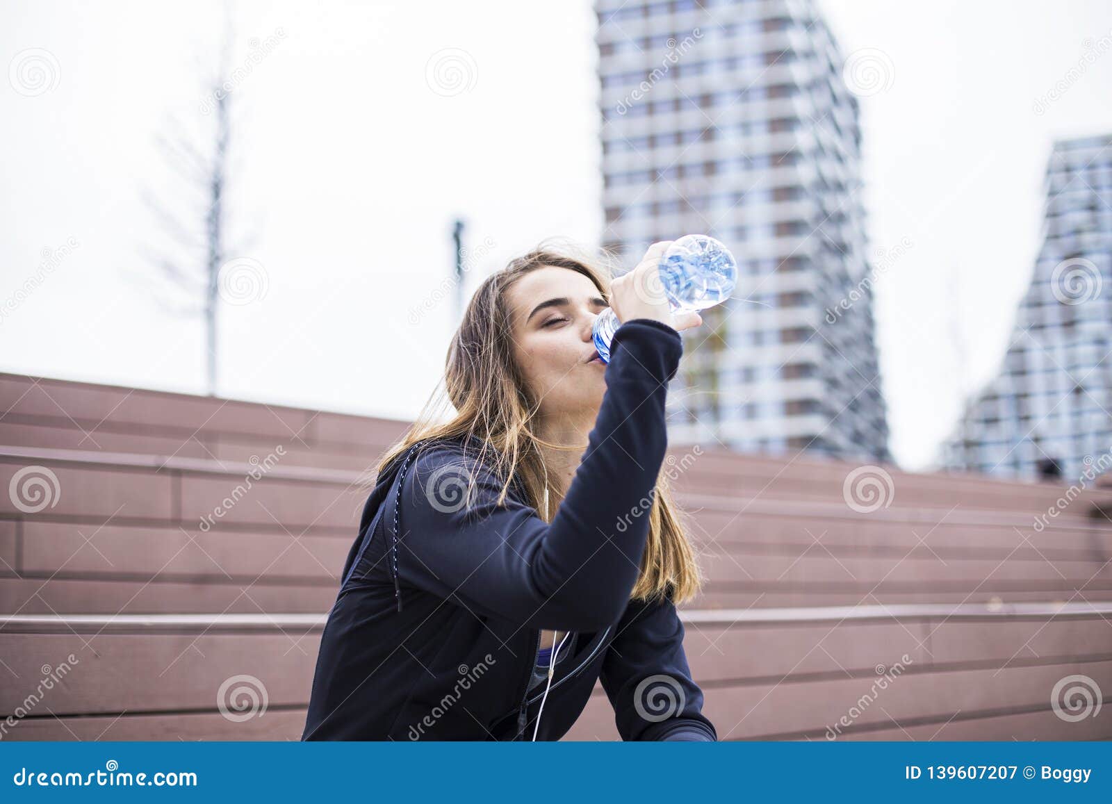 Young Woman is Refreshed after the Training Stock Image - Image of ...