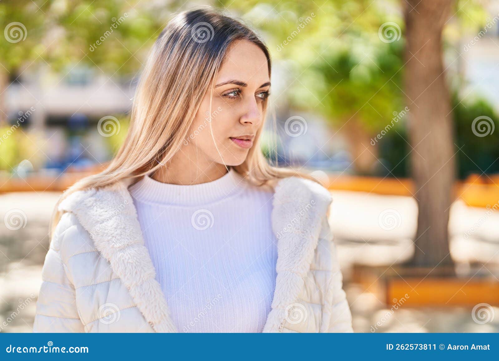 Young Woman with Relaxed Expression Standing at Park Stock Image ...