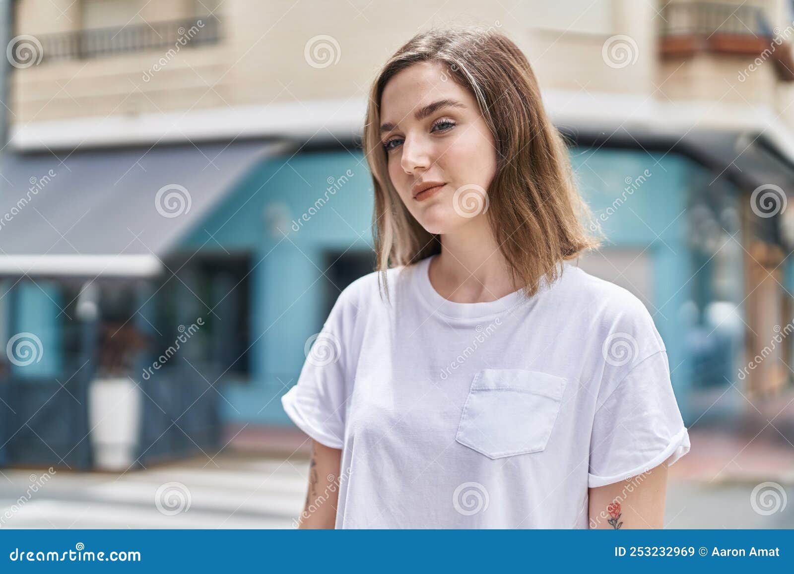 Young Woman with Relaxed Expression Standing at Street Stock Image ...