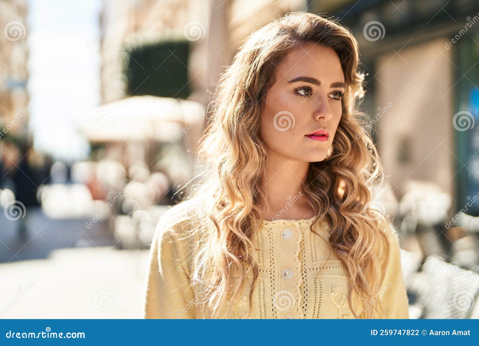 Young Woman with Relaxed Expression Standing at Street Stock Photo ...