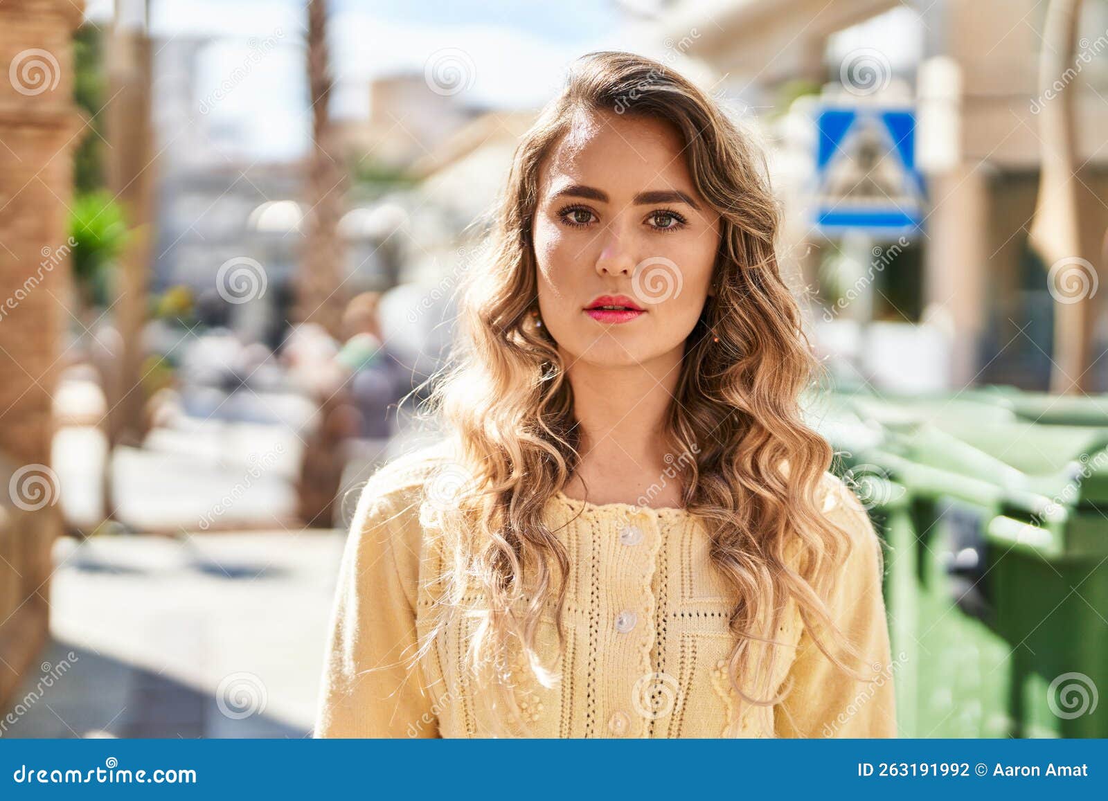 Young Woman with Relaxed Expression Standing at Street Stock Photo ...