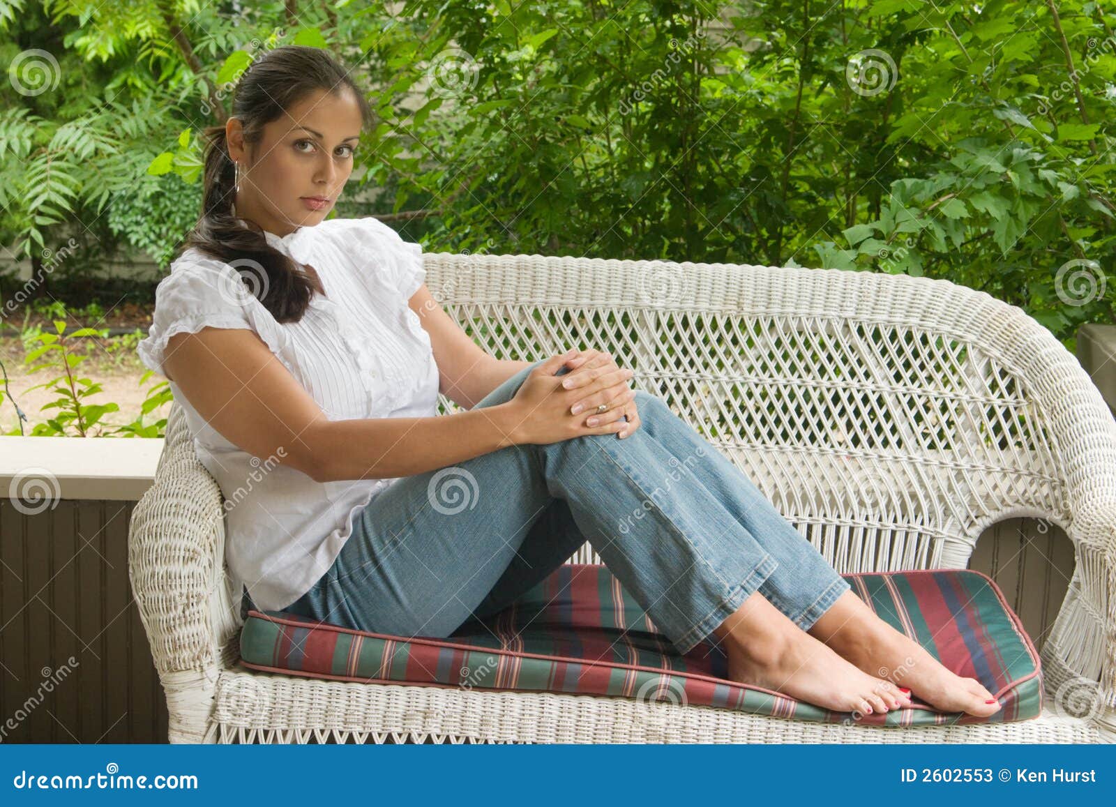 Young Woman Relaxing on Porch Stock Image - Image of summer, barefoot ...