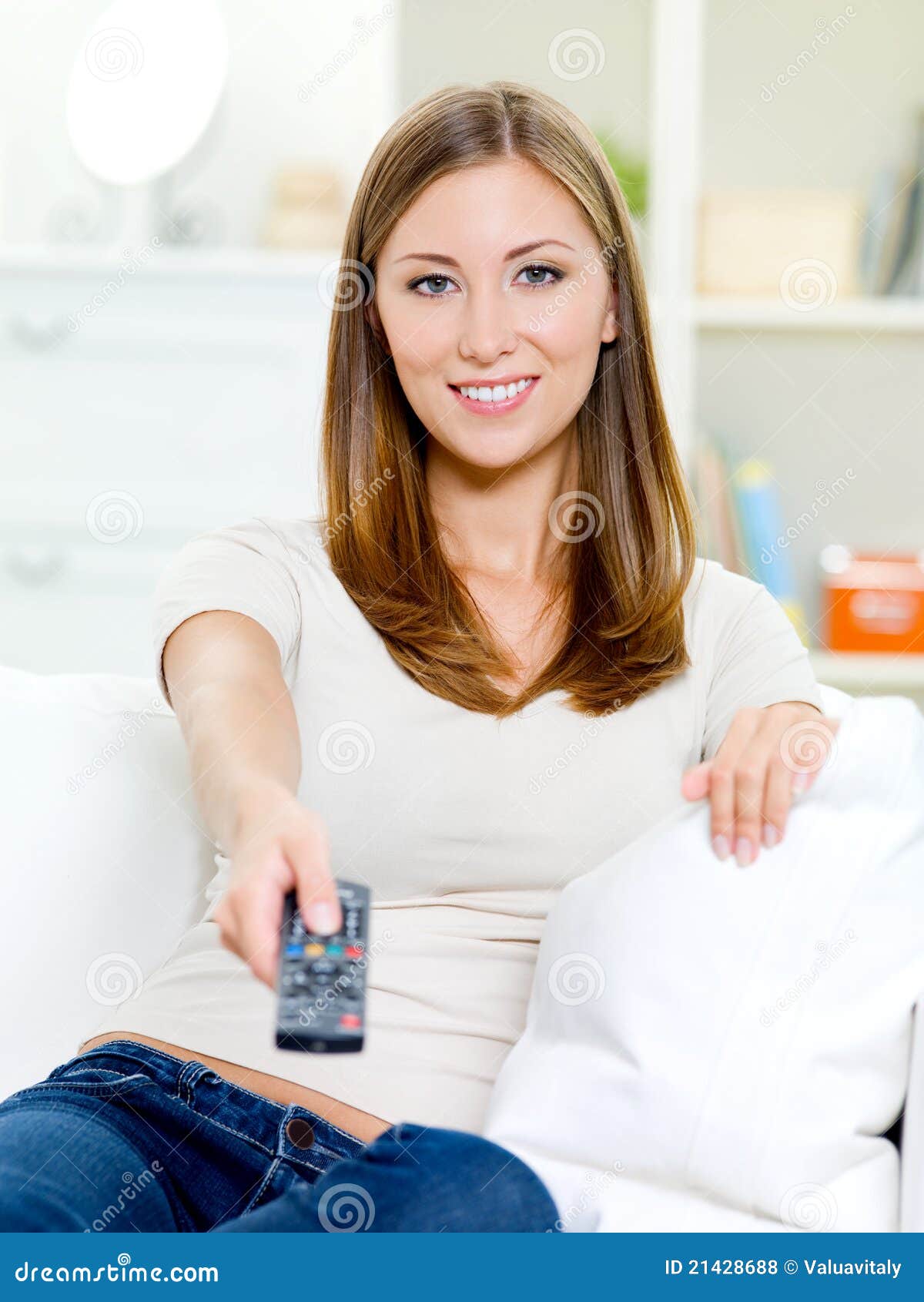 Young Woman with Remote Control Sitting Stock Photo - Image of woman ...