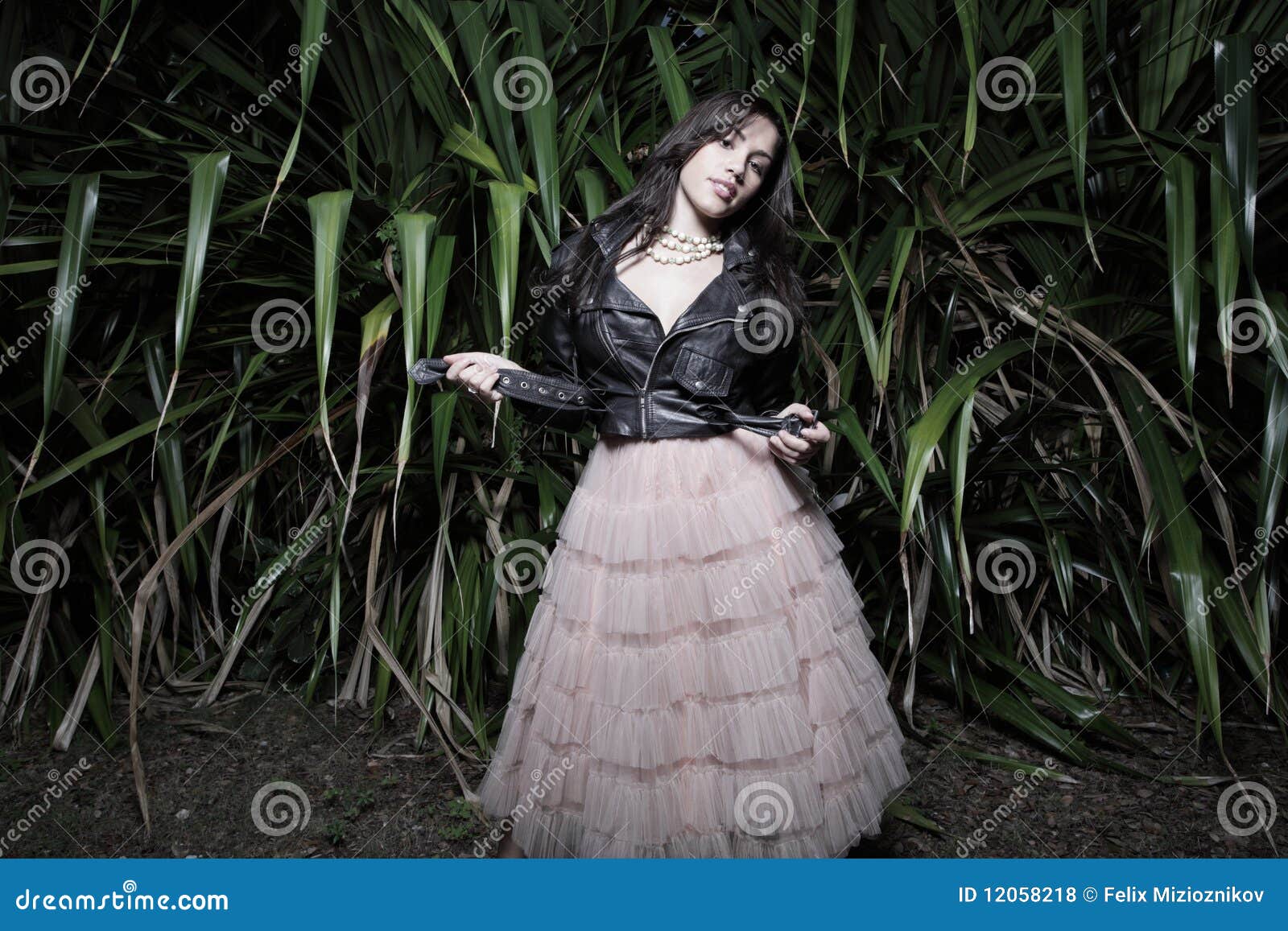 Young Woman Removing Her Jacket Stock Photo - Image of leather, color ...