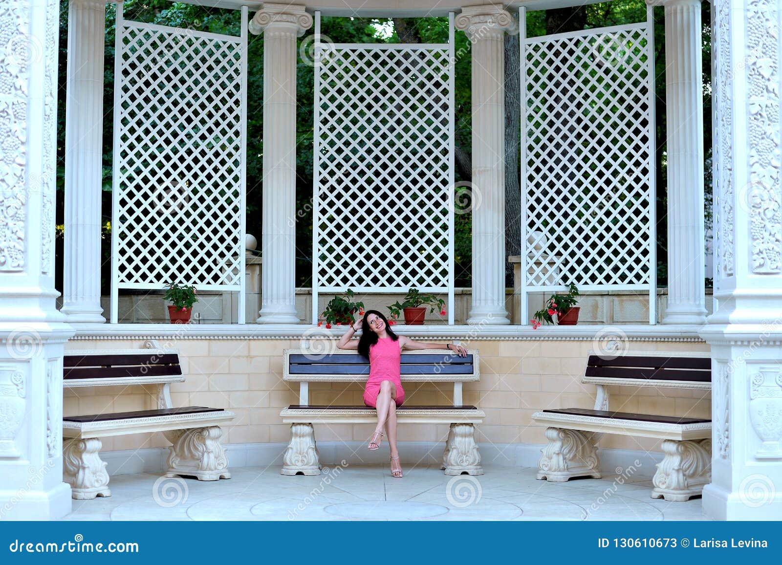 Young Woman Resting on a Bench in a Beautiful Park. Stock Image - Image ...