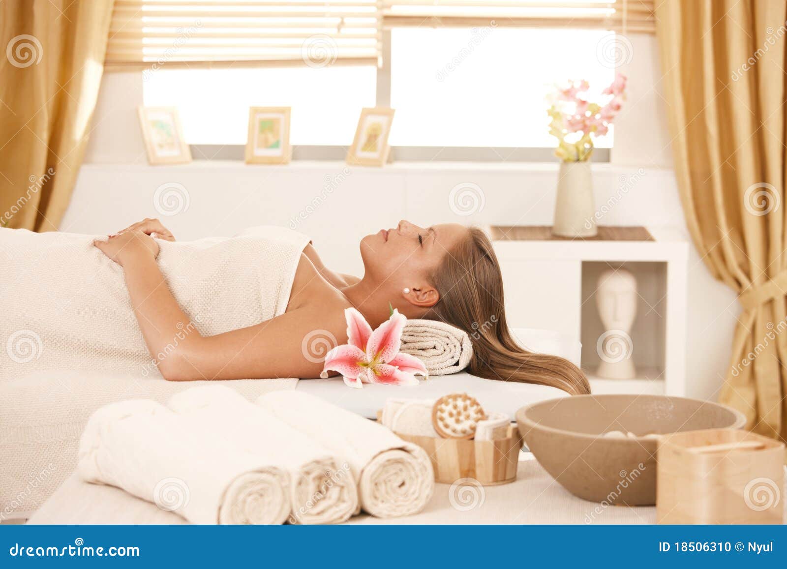 Young Woman Resting on Massage Bed at Spa. Stock Photo - Image of care ...
