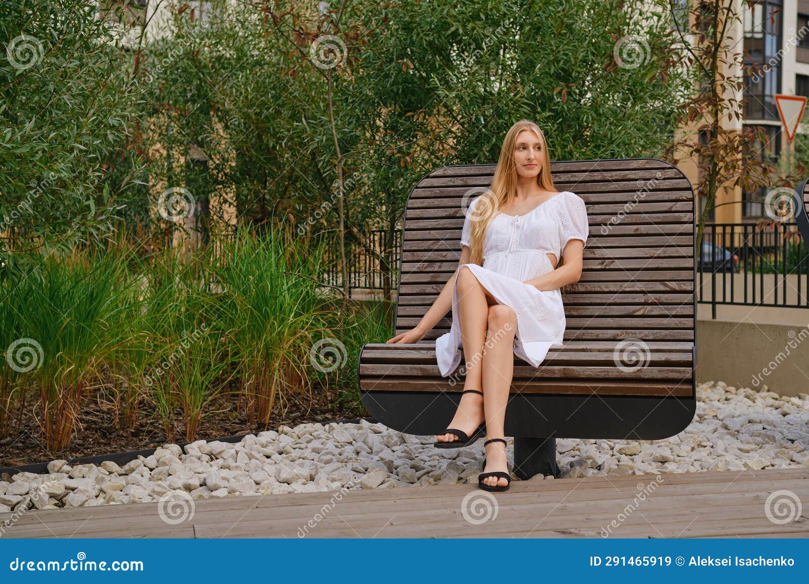 Young Woman Sitting on a Rotating Bench Stock Image - Image of activity ...