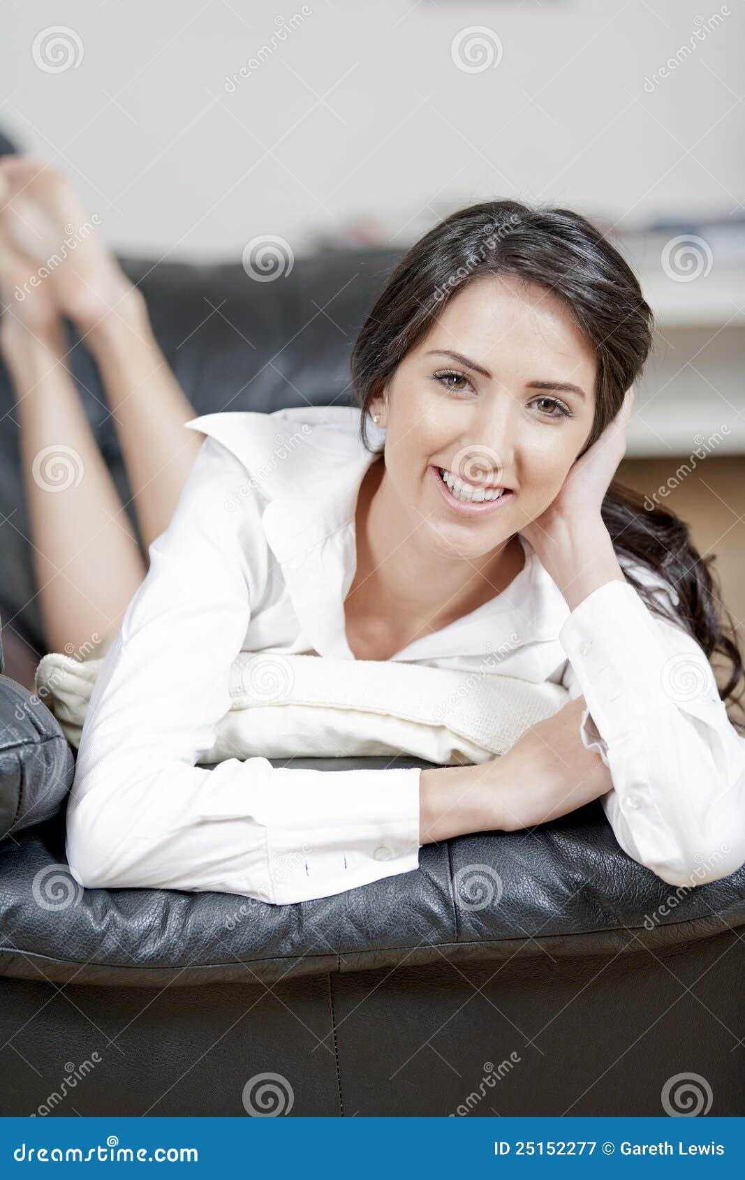 Young Woman Resting on Sofa Stock Image - Image of sitting, smiling ...