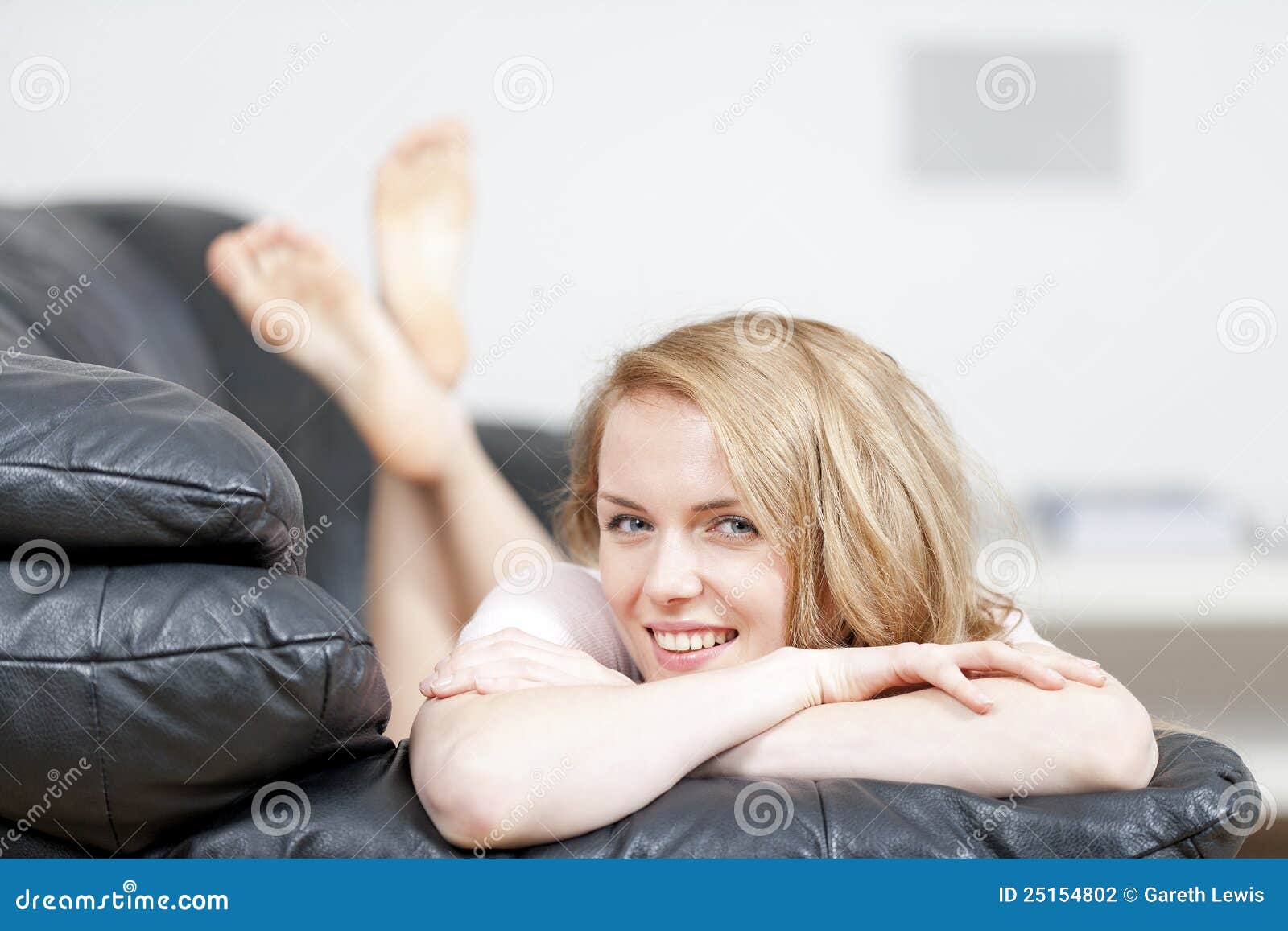 Young Woman Resting on Sofa Stock Photo - Image of casual, sofa: 25154802