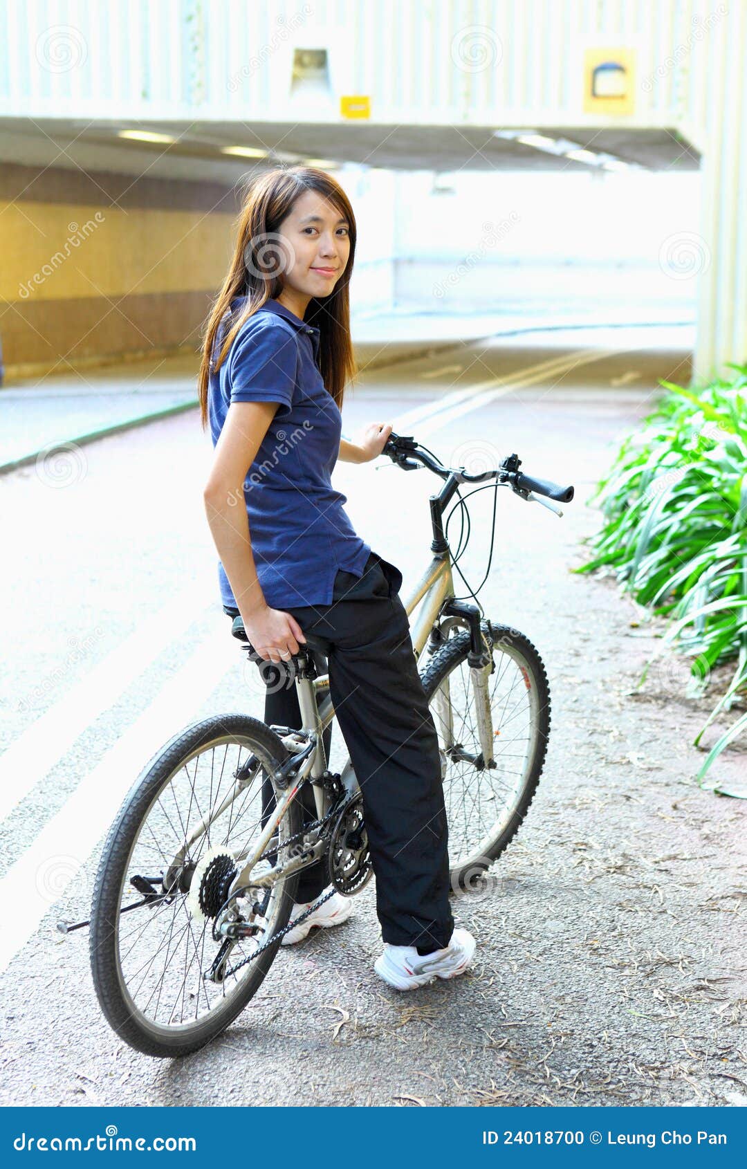 Young woman riding bicycle stock photo. Image of active - 24018700