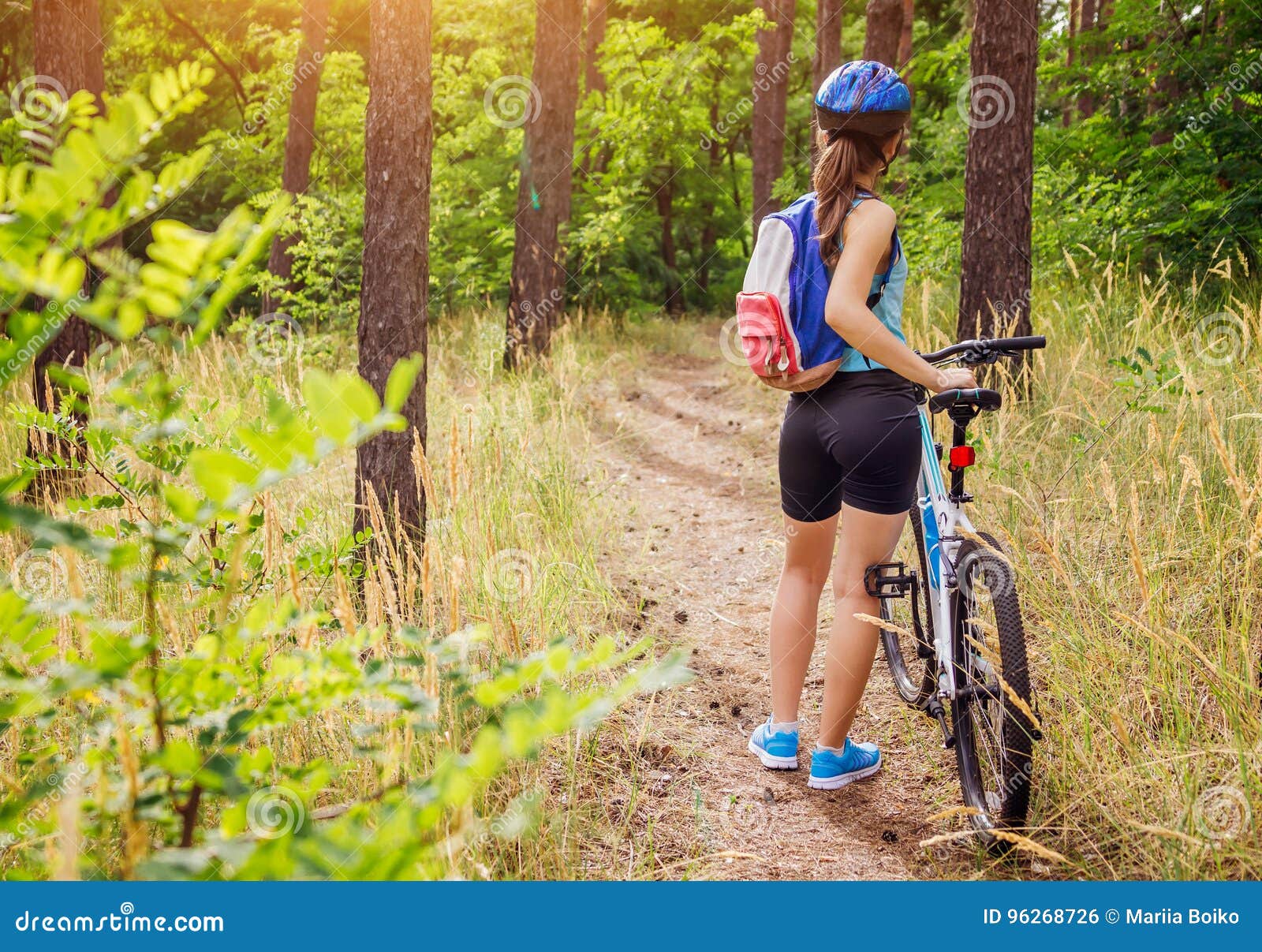 Young Woman Riding a Bicycle in the Forest Stock Photo - Image of ...
