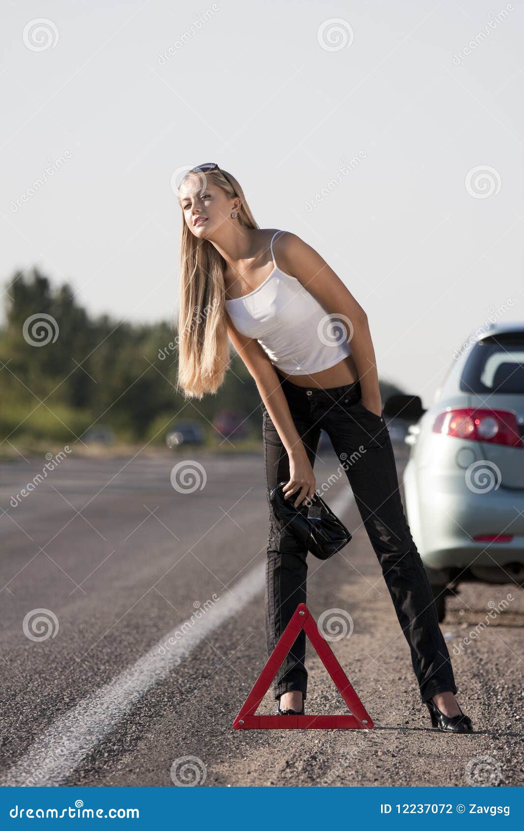 Young woman on the road stock photo. Image of driver - 12237072