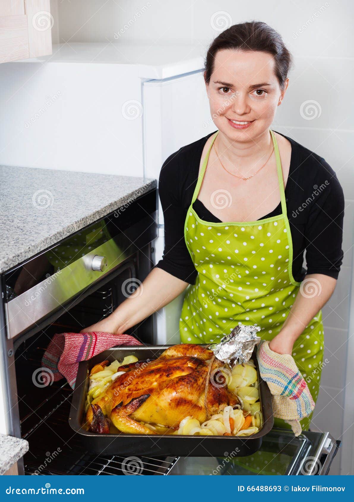 Young Woman Roasting Cockerel for Dinner Stock Image - Image of female ...