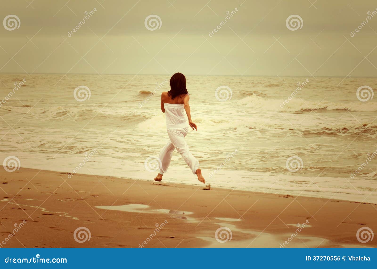 Young Woman Runing on the Beach Stock Photo - Image of girl, beautiful ...