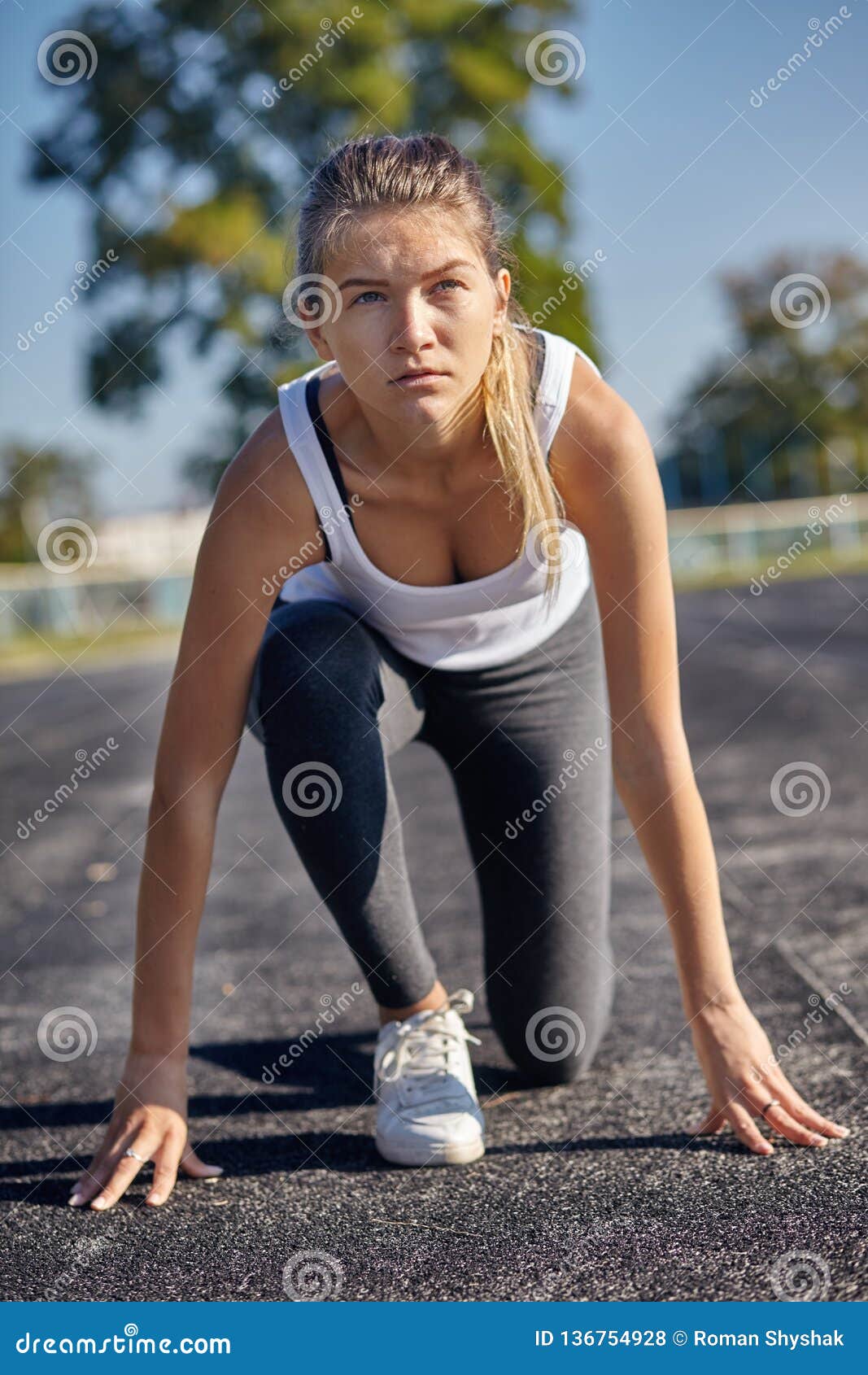 A Young Woman Runner Getting Ready for a Run on Track Stock Photo ...