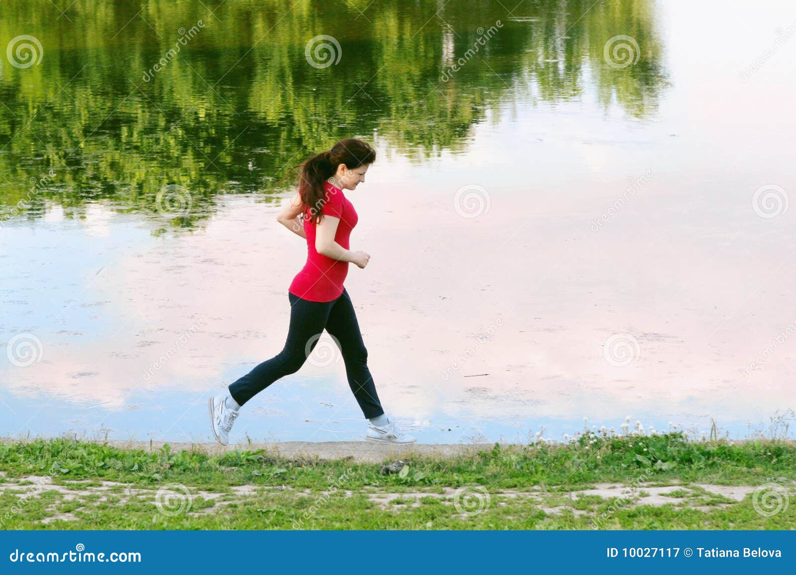 Young woman running stock image. Image of reflection - 10027117