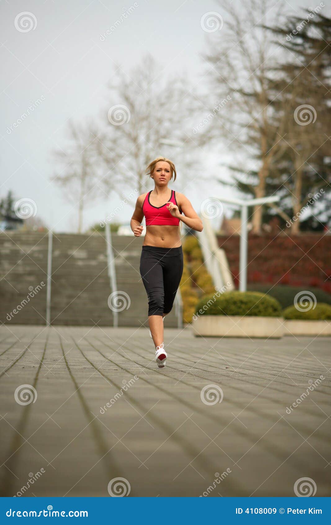 Young woman running stock image. Image of healthy, campus - 4108009
