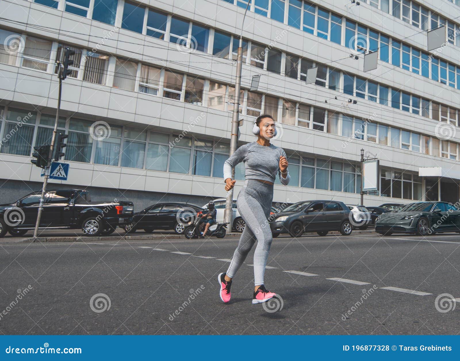 A Young Woman Running Fast at the Intersection Stock Photo - Image of ...