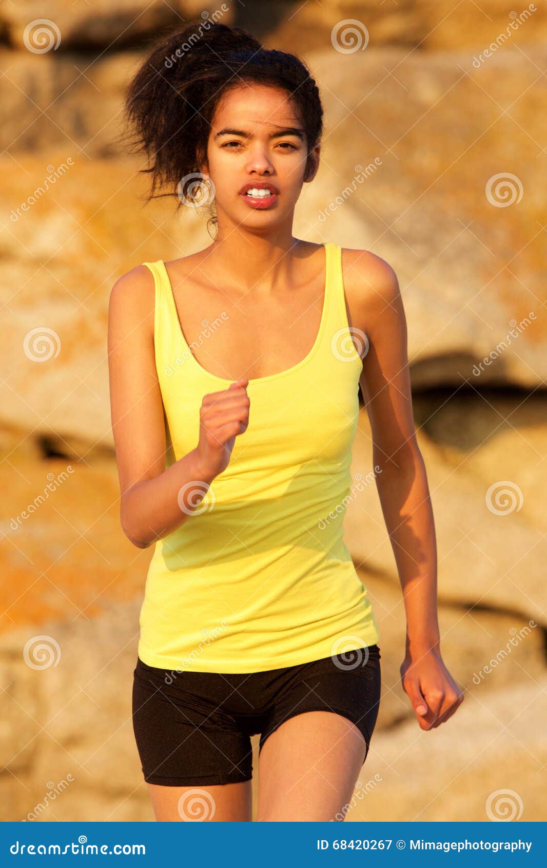 Young Woman Running Forward Stock Image - Image of athlete, beach: 68420267