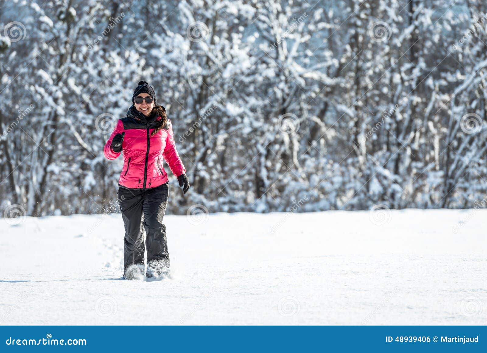 Young Woman Running through the Snow Stock Photo - Image of sport ...