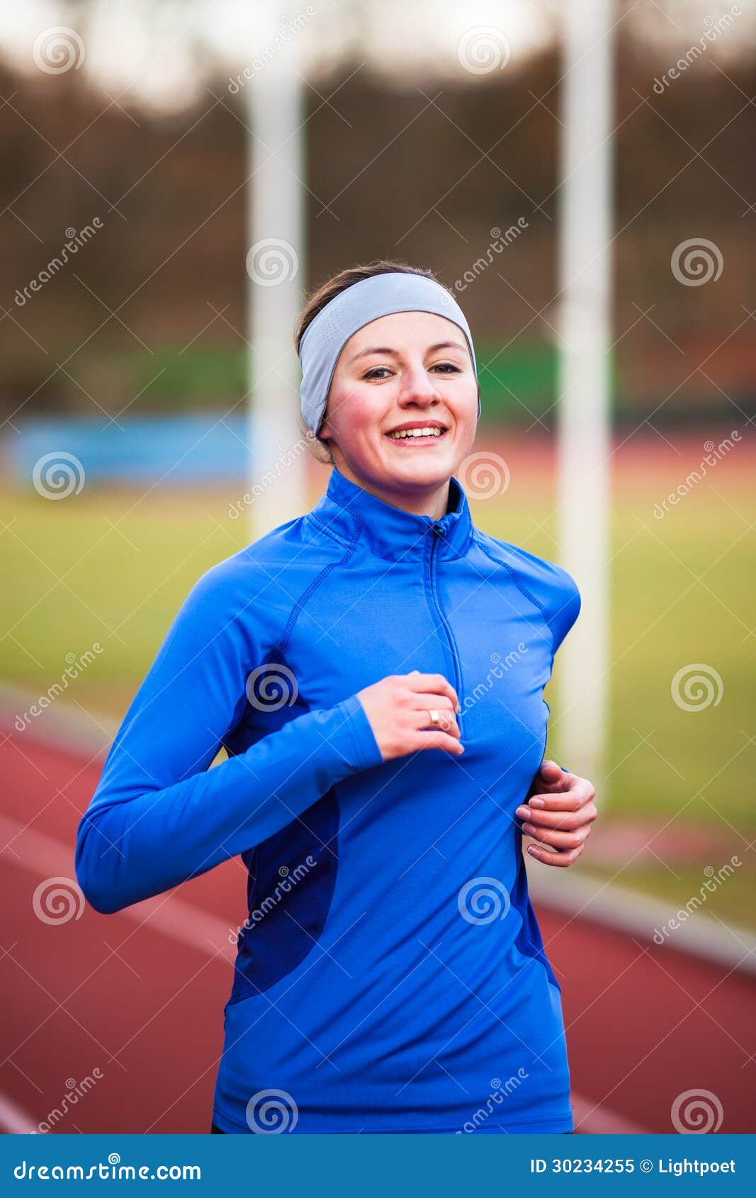 Young Woman Running at a Track Stock Image - Image of exercise, field ...