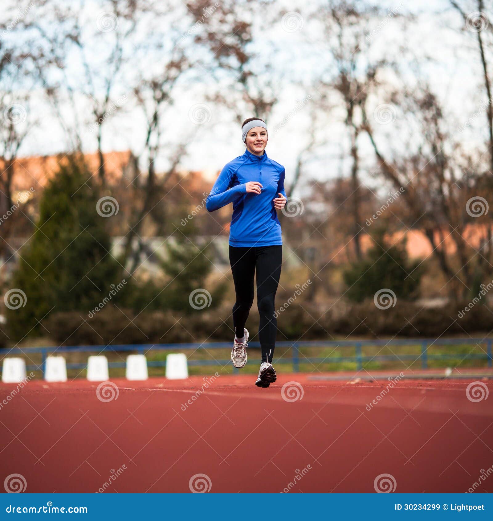 Young Woman Running at a Track Stock Image - Image of energy, cheerful ...