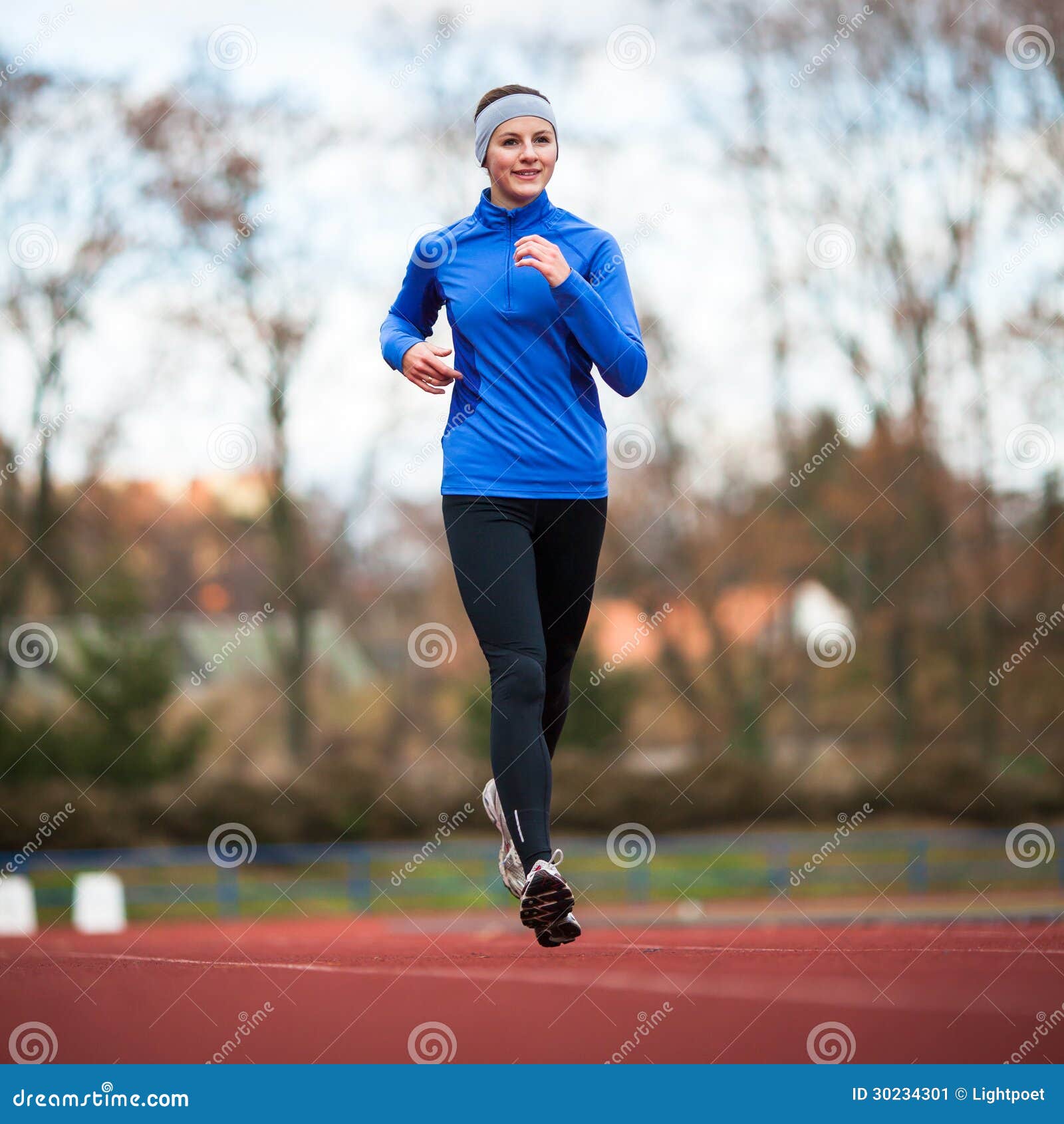 Young Woman Running at a Track Stock Image - Image of field, outdoors ...