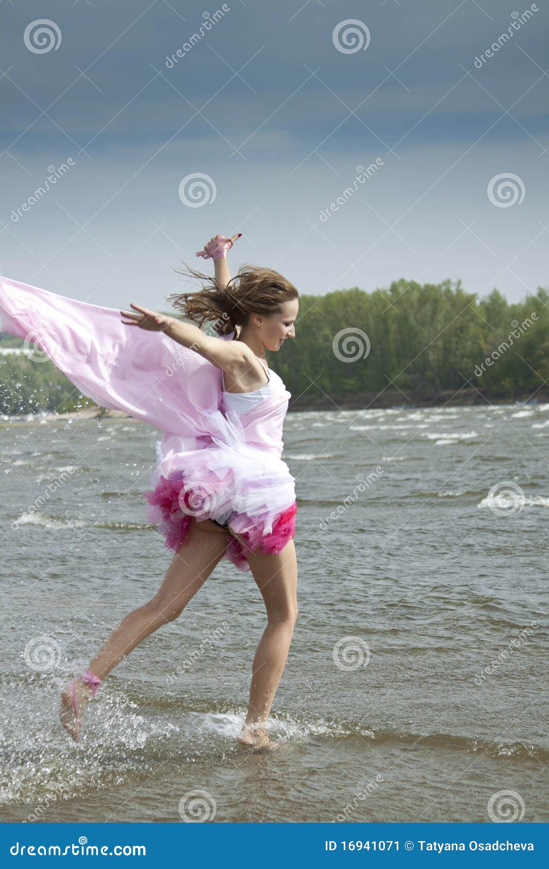 Young Woman Running through the Water at the Beach Stock Image - Image ...