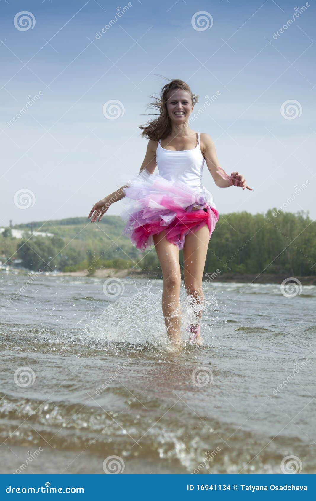 Young Woman Running through the Water at the Beach Stock Photo - Image ...