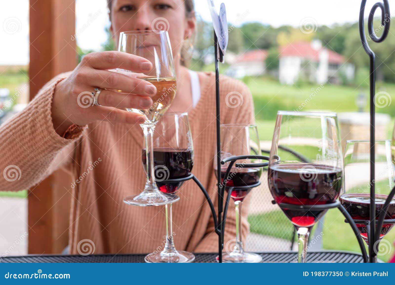 Young Woman Sampling Wine at an Outdoor Table Stock Photo - Image of ...