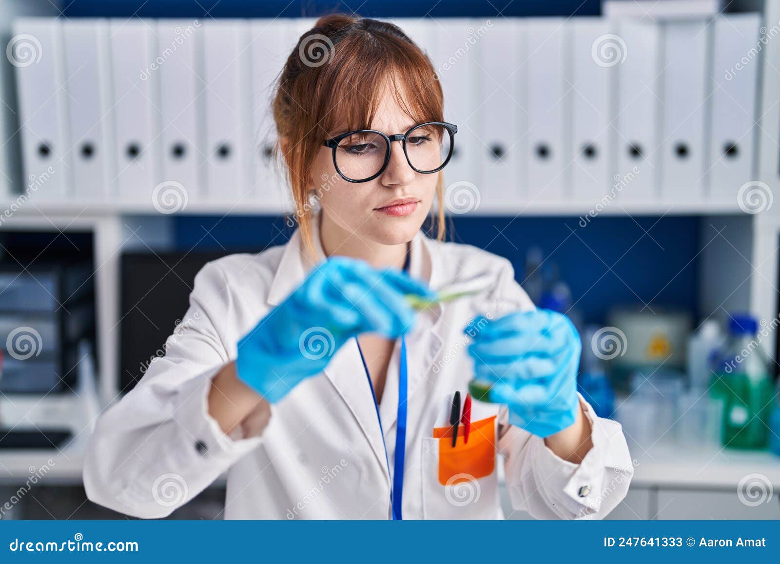 Young Woman Scientist Measuring Liquid at Laboratory Stock Image ...