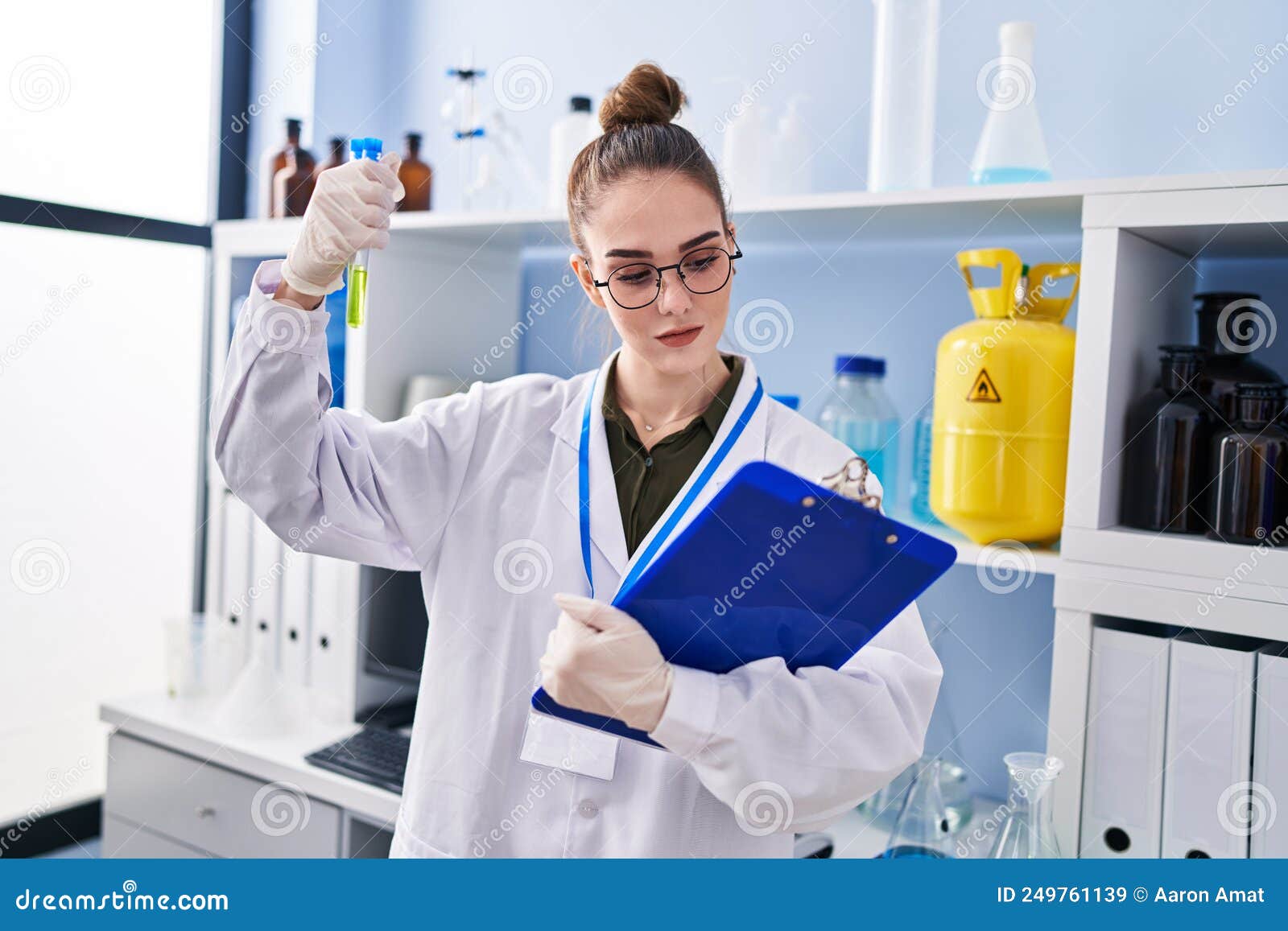 Young Woman Scientist Measuring Liquid at Laboratory Stock Image ...