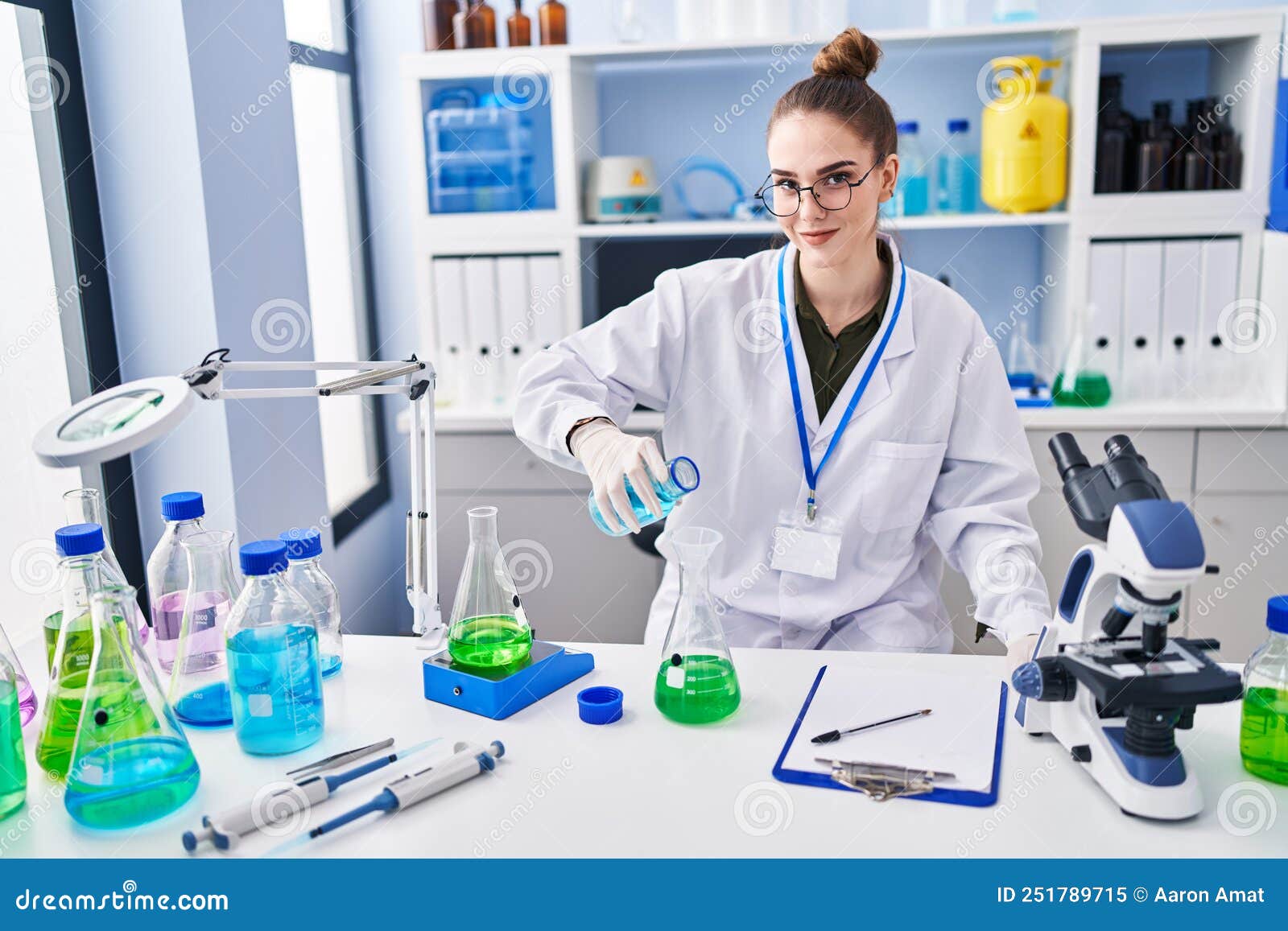 Young Woman Scientist Measuring Liquid at Laboratory Stock Image ...