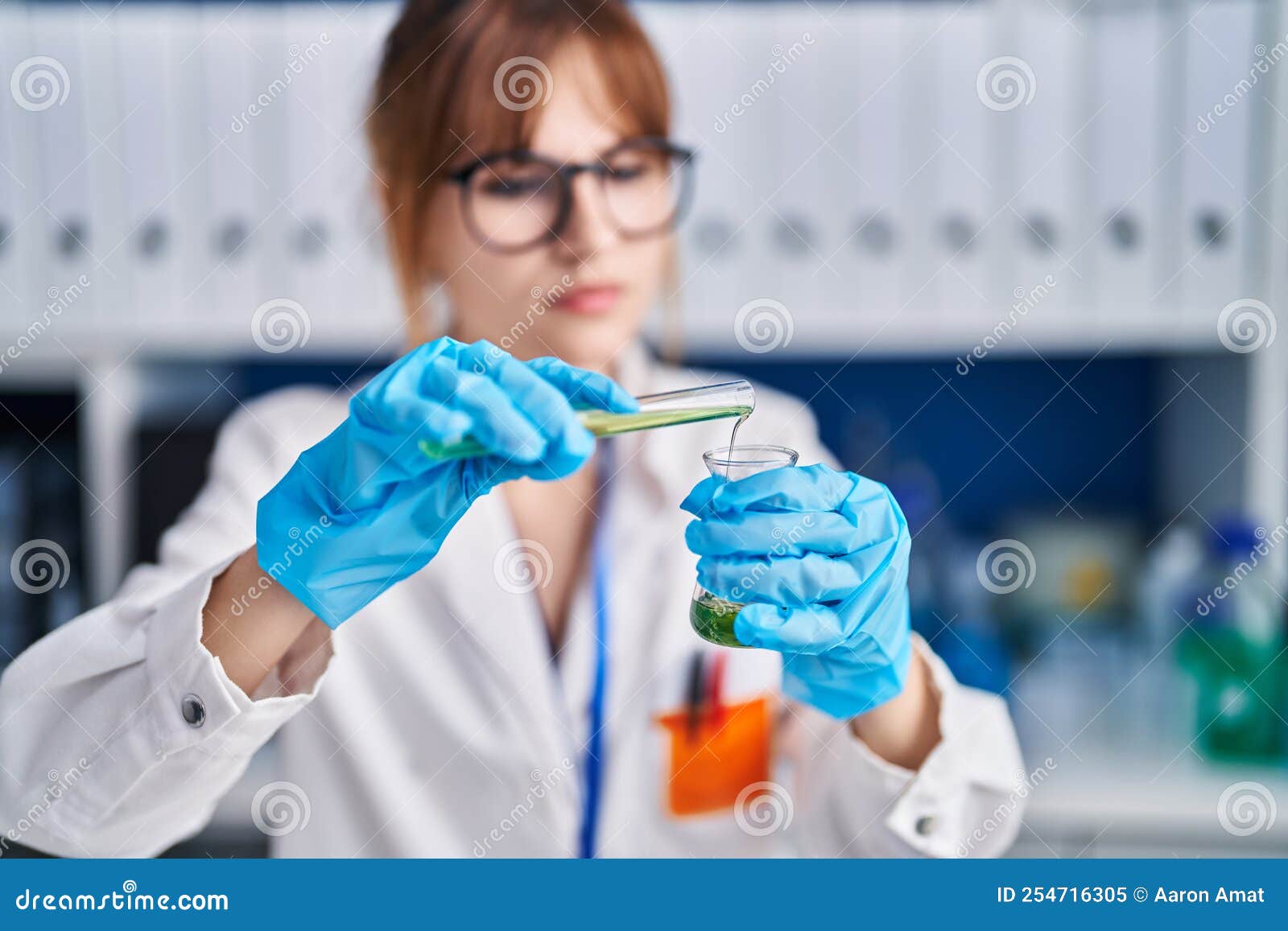 Young Woman Scientist Measuring Liquid at Laboratory Stock Image ...