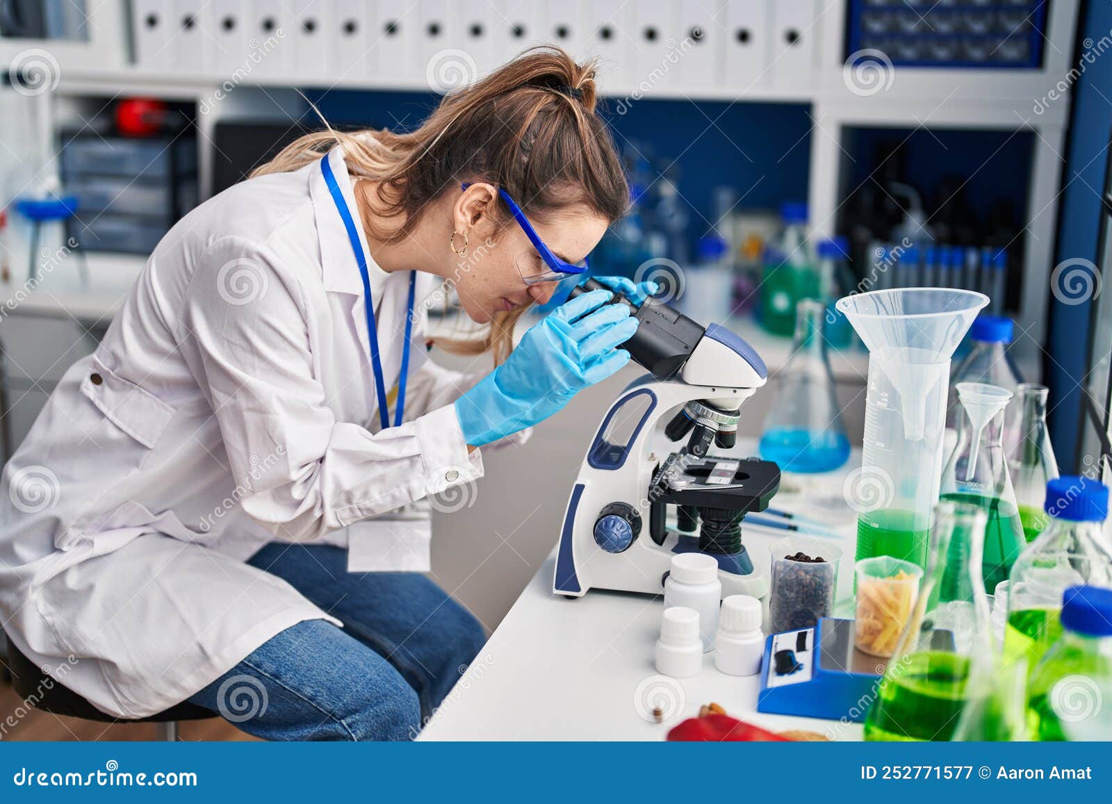 Young Woman Scientist Using Microscope at Laboratory Stock Image ...