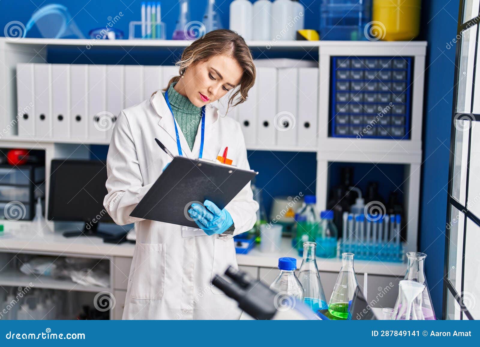 Young Woman Scientist Writing Report at Laboratory Stock Image - Image ...