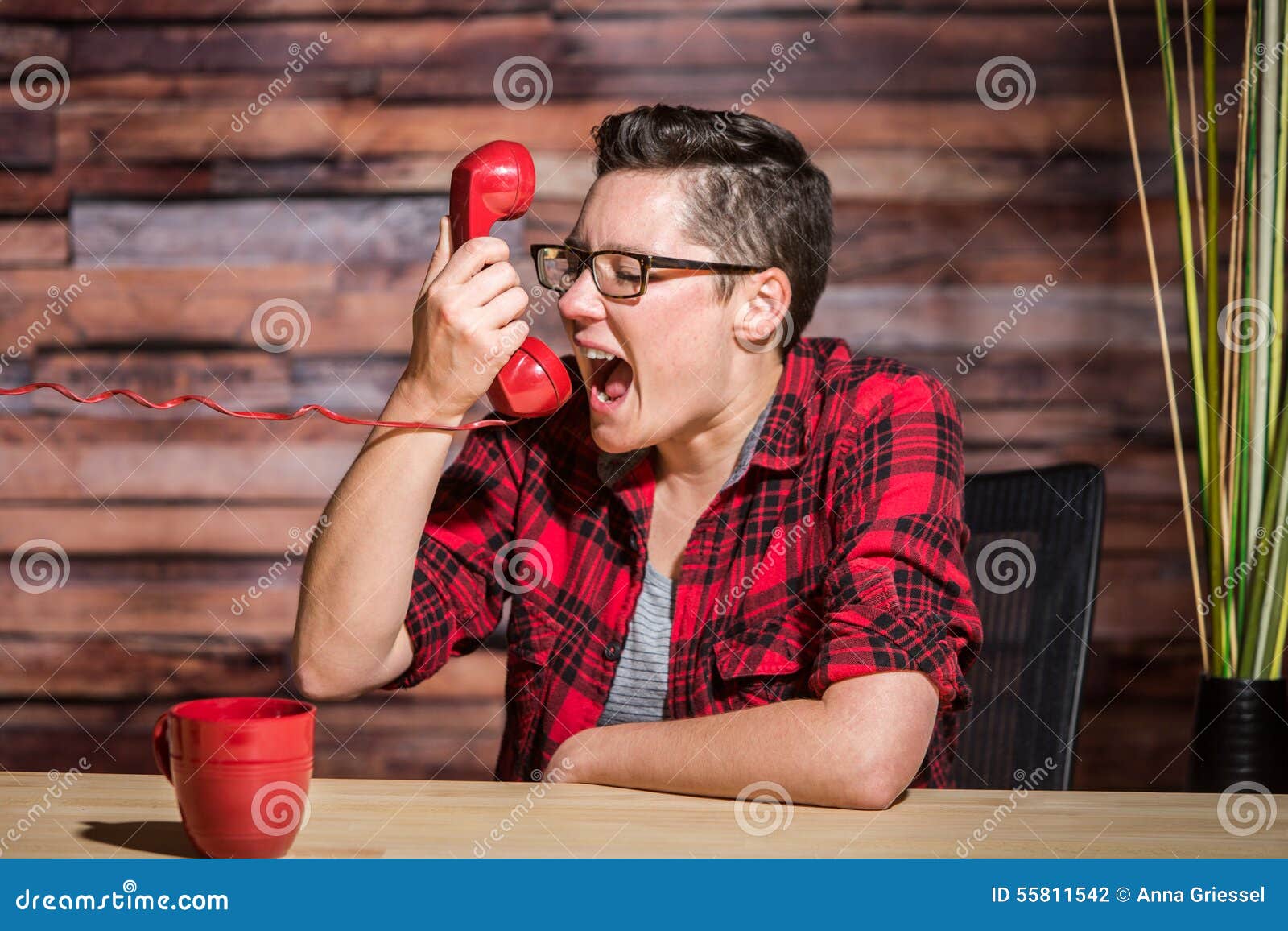 Young Woman Screams into Phone Stock Photo - Image of loud, overworked ...