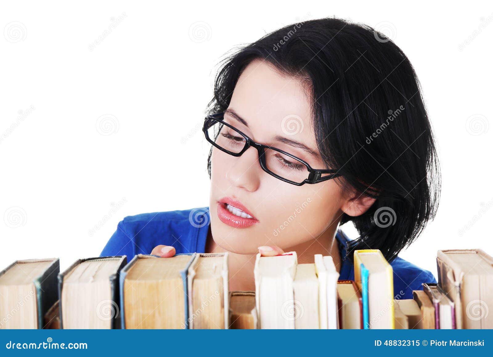 Young Woman Searching for an Interesting Book Stock Image - Image of ...