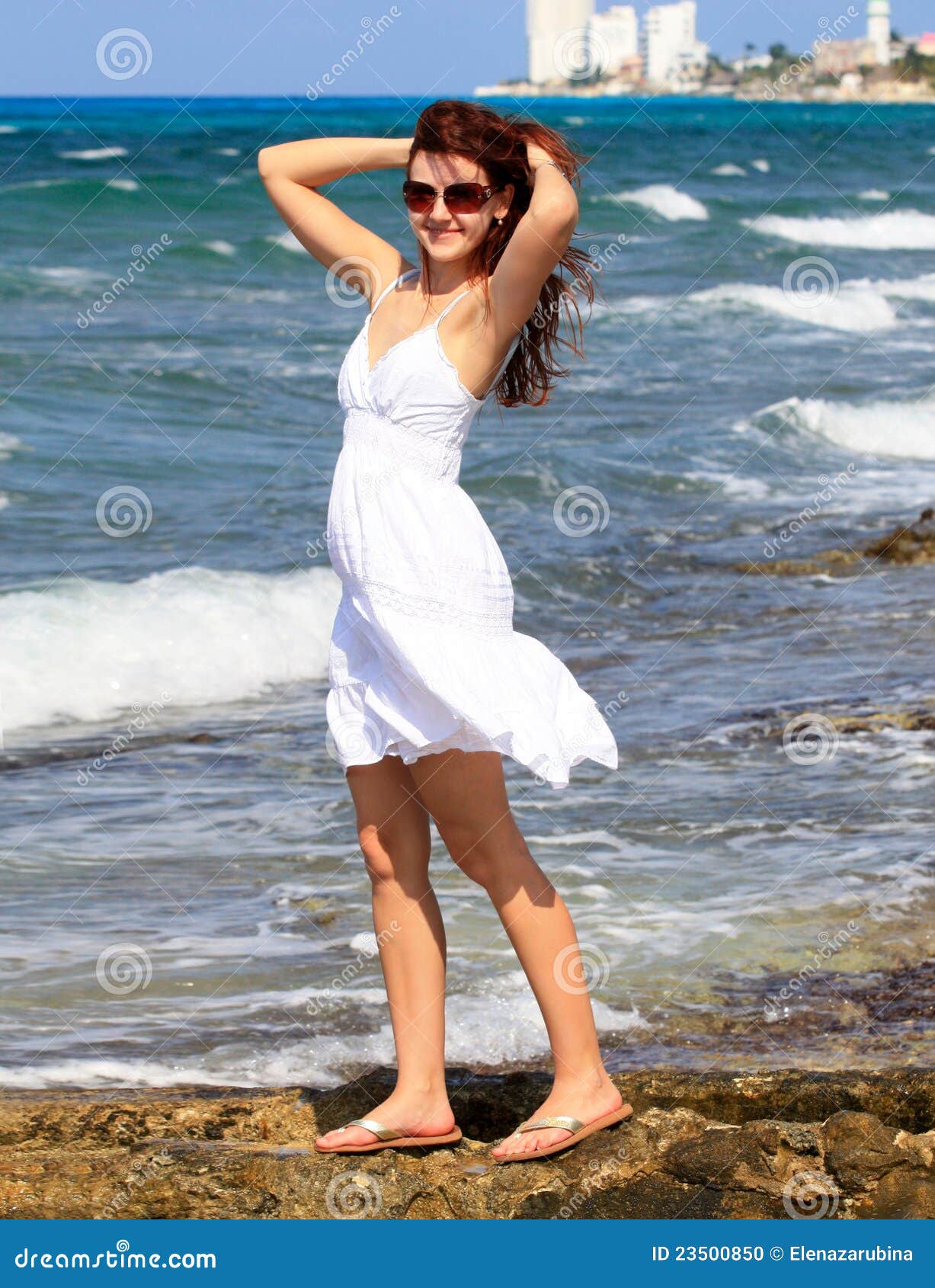 Young woman at the seaside stock photo. Image of water - 23500850