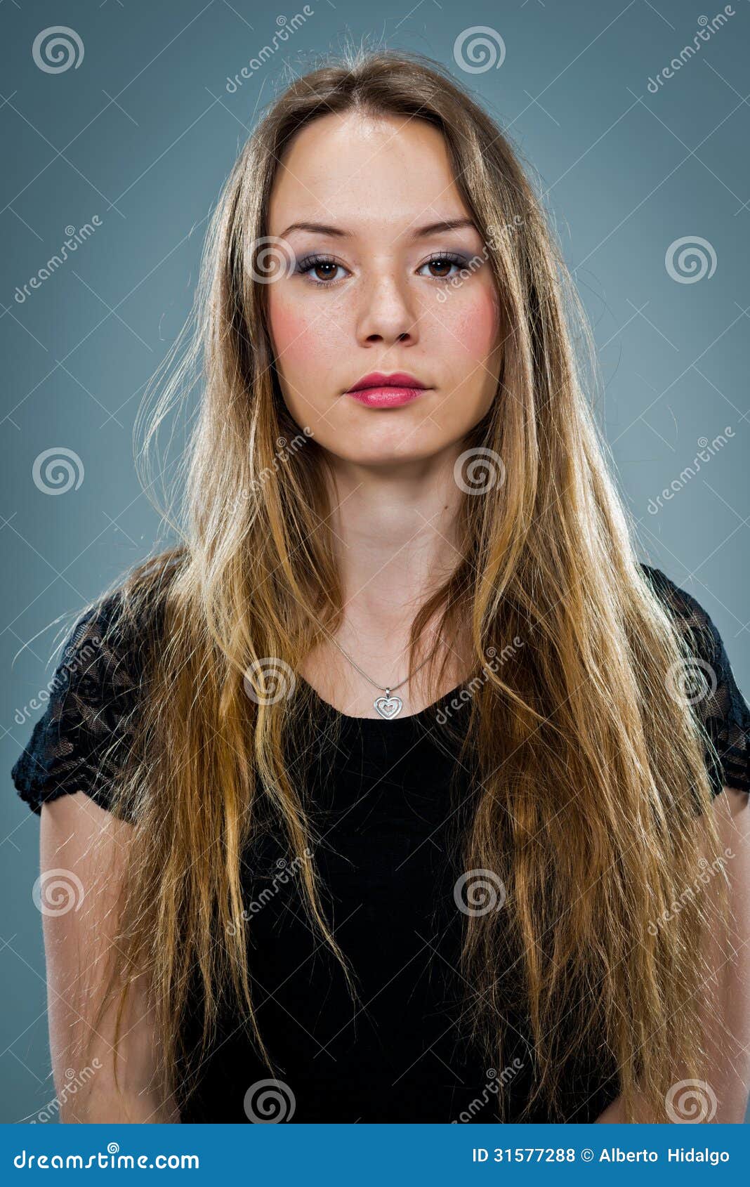 Young Woman with Serious Expression Stock Photo - Image of face, people ...