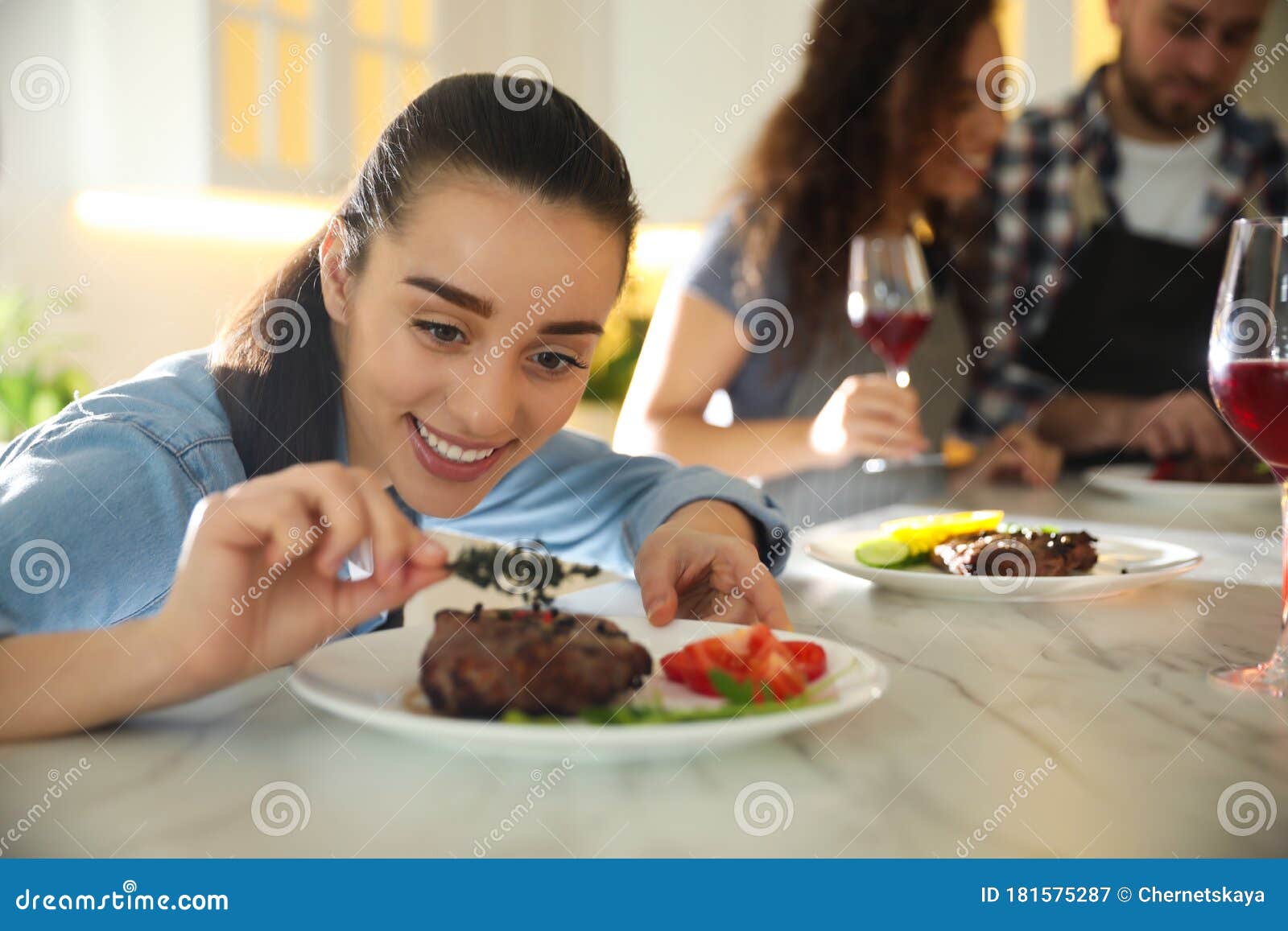 Woman Serving Food in Crowded Kitchen. Cooking Class Stock Image ...