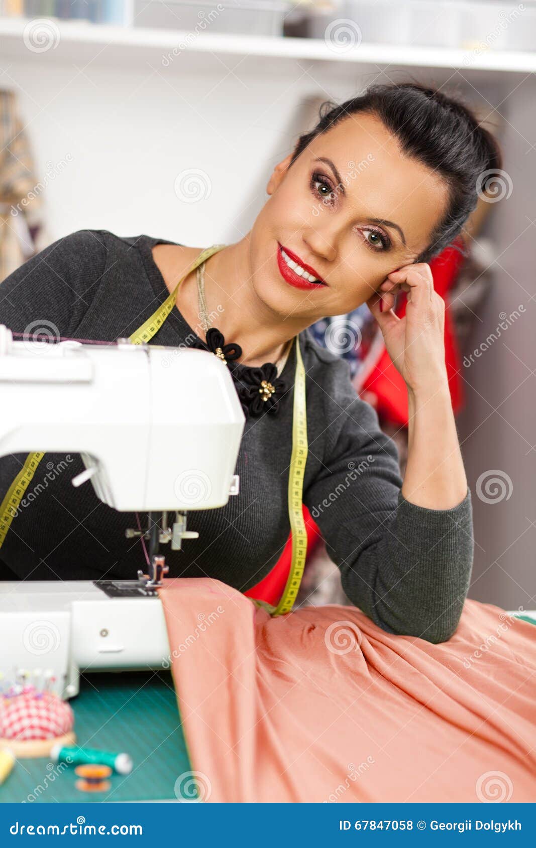 Young Woman at a Sewing Machine Stock Photo - Image of attractive ...