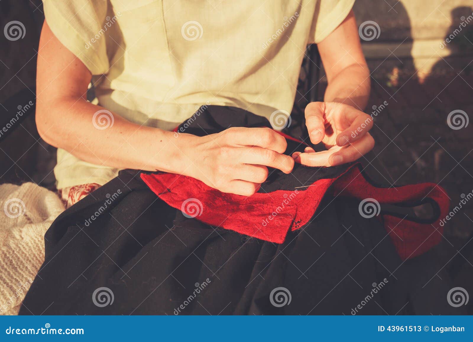 Young woman sewing outside stock image. Image of clothing - 43961513