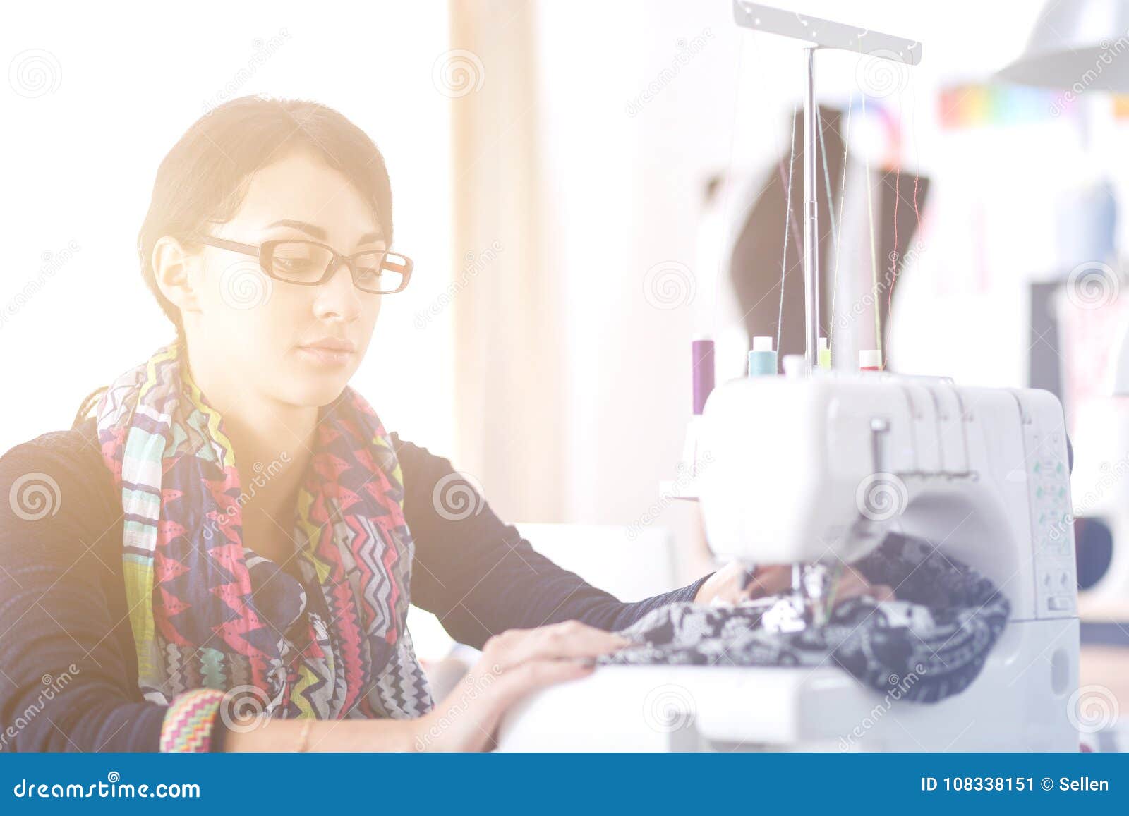 Young Woman Sewing while Sitting at Her Working Place . Stock Image ...