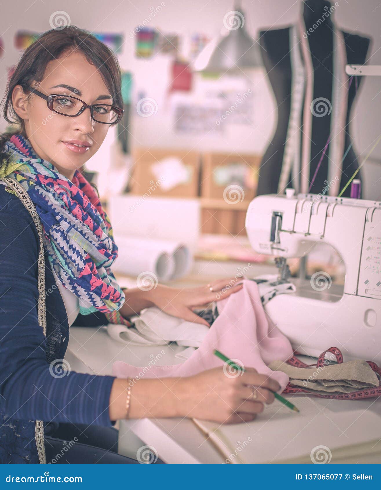 Young Woman Sewing while Sitting at Her Working Place Stock Image ...