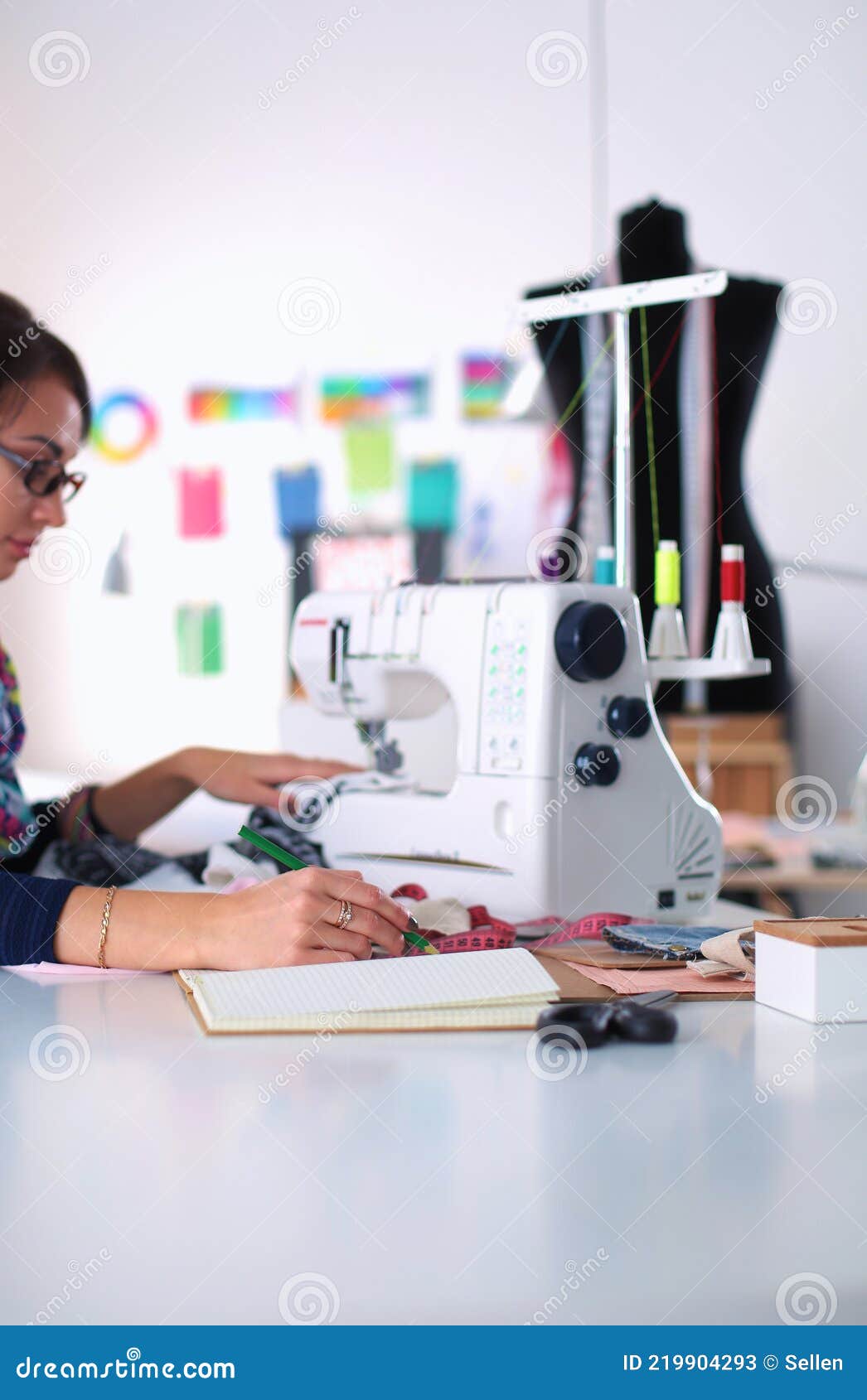 Young Woman Sewing while Sitting at Her Working Place Stock Image ...