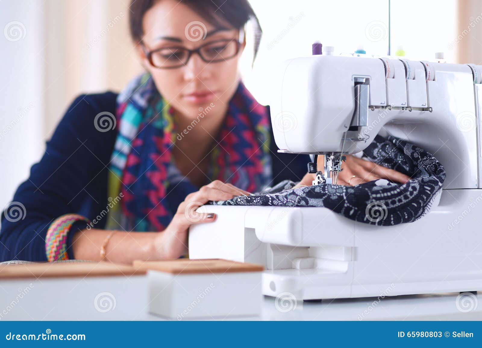 Young Woman Sewing while Sitting at Her Working Place Stock Image ...