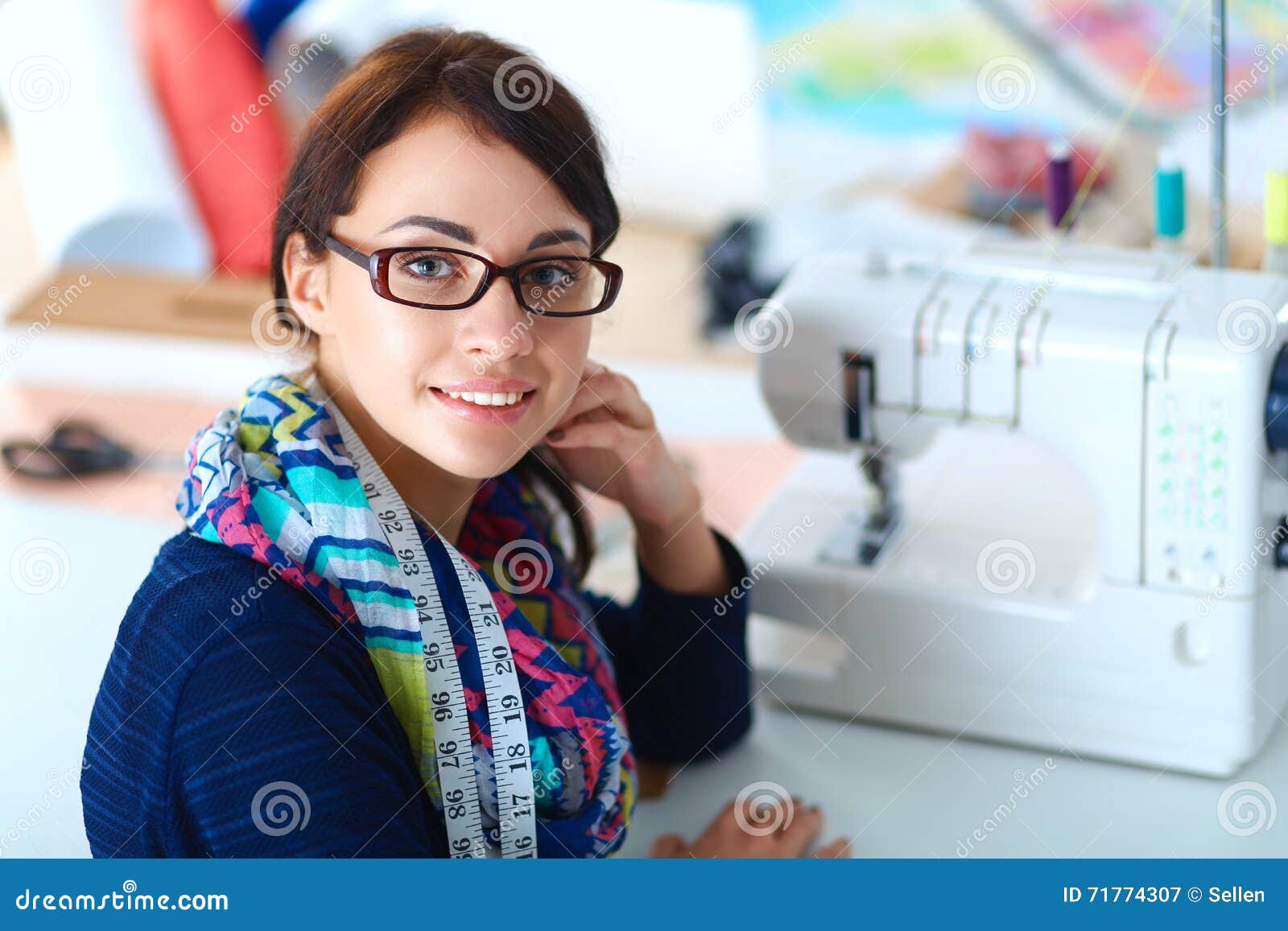 Young Woman Sewing while Sitting at Her Working Place Stock Image ...