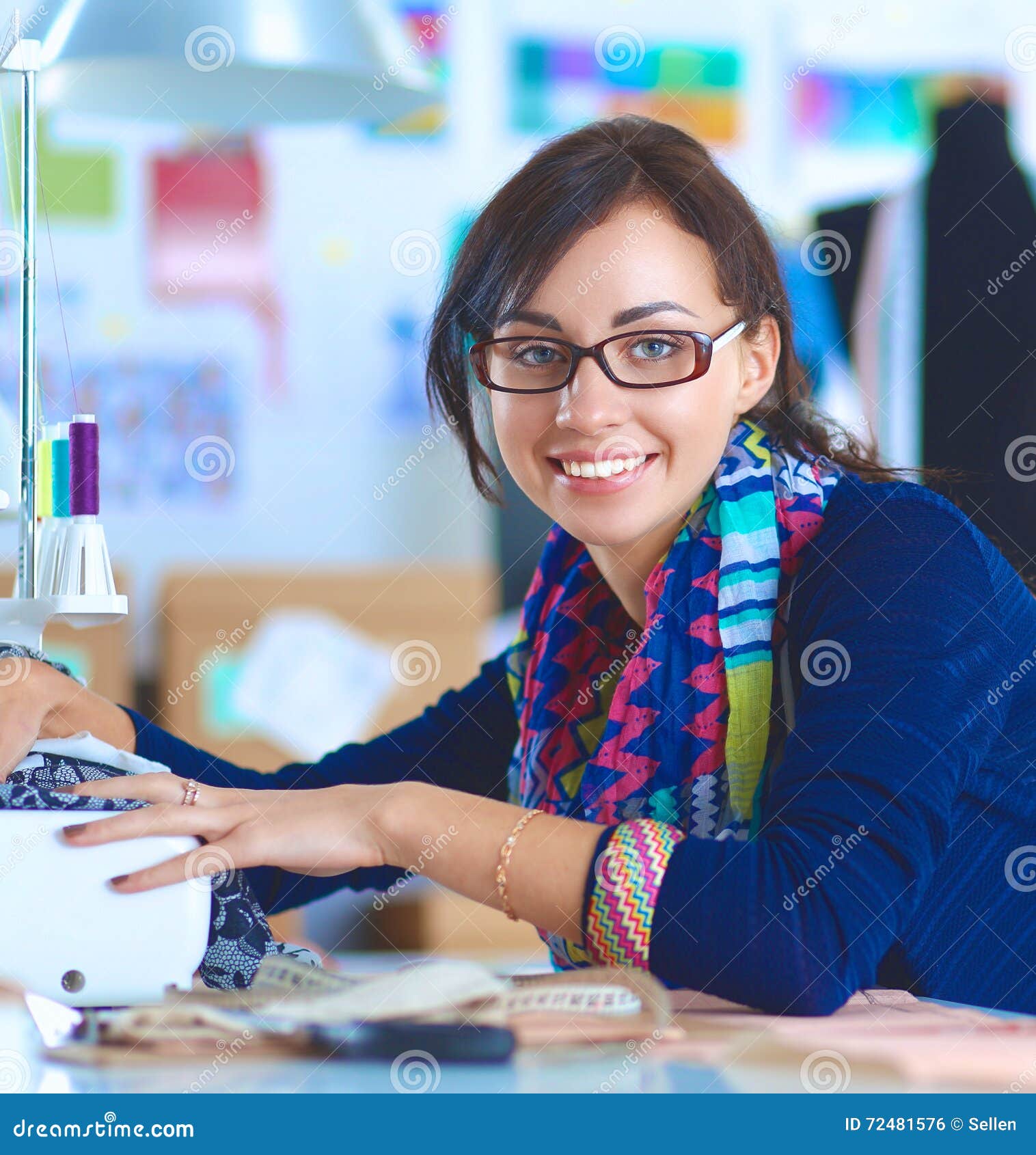 Young Woman Sewing while Sitting at Her Working Place Stock Photo ...