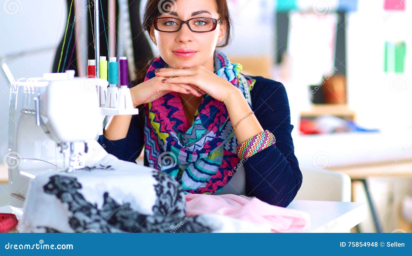 Young Woman Sewing while Sitting at Her Working Place Stock Photo ...
